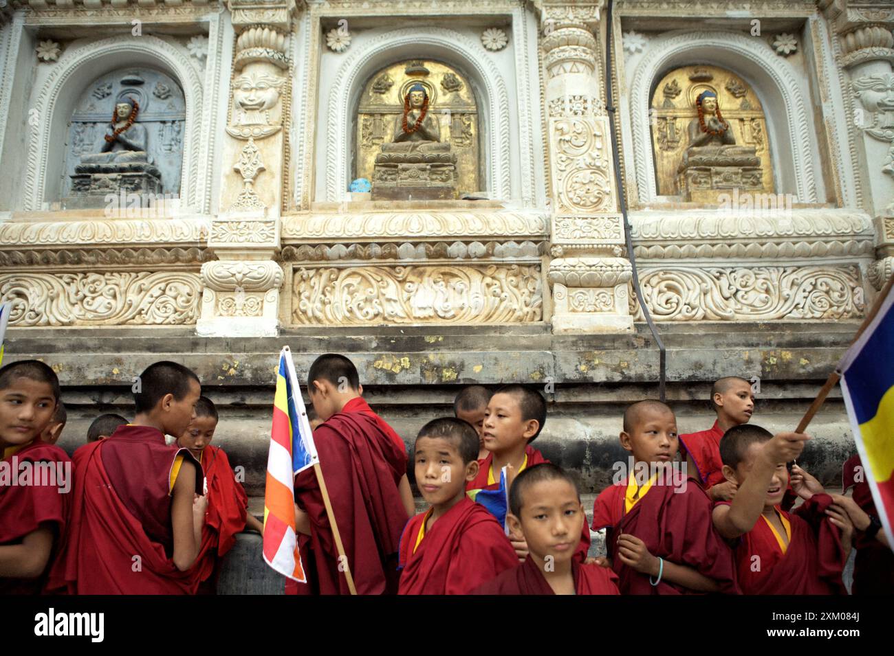 Child monks queueing to pray at Mahabodhi temple in Bodhgaya, Bihar ...