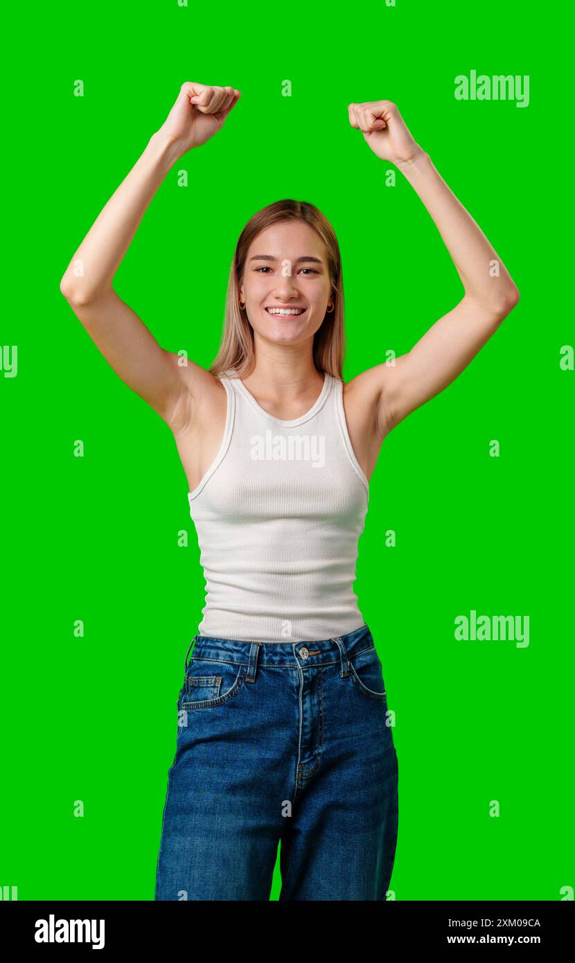 Happy Young Woman Celebrating Success With Arms Raised in Green Screen ...