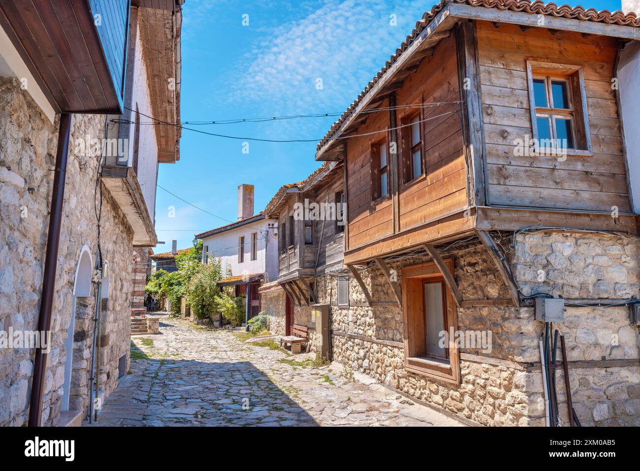 Traditional buildings on cobbled street in old town of Nessebar ...
