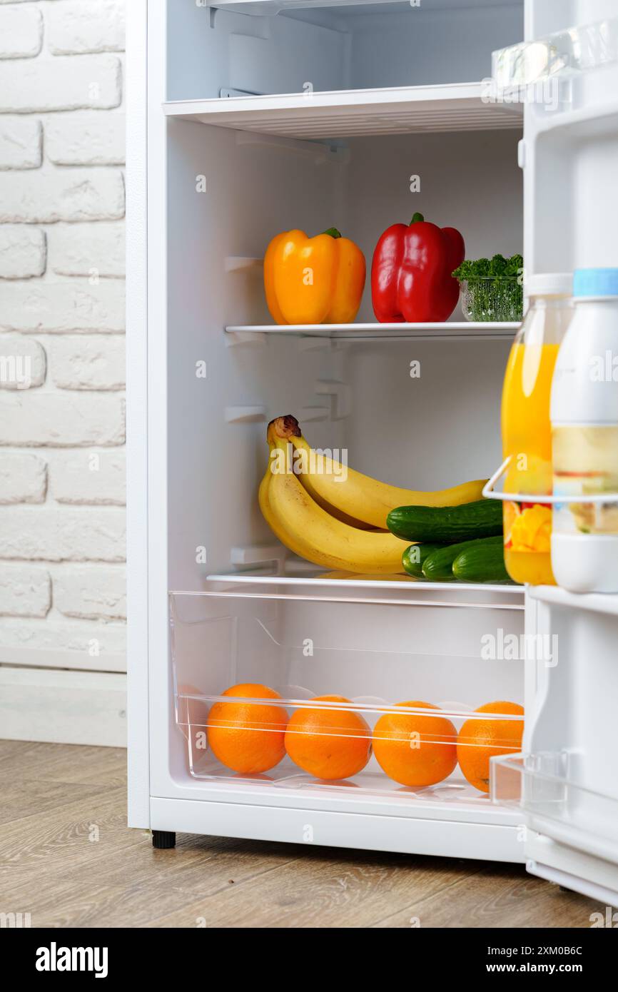 Open Refrigerator Door Showing Fresh Produce Inside Stock Photo - Alamy