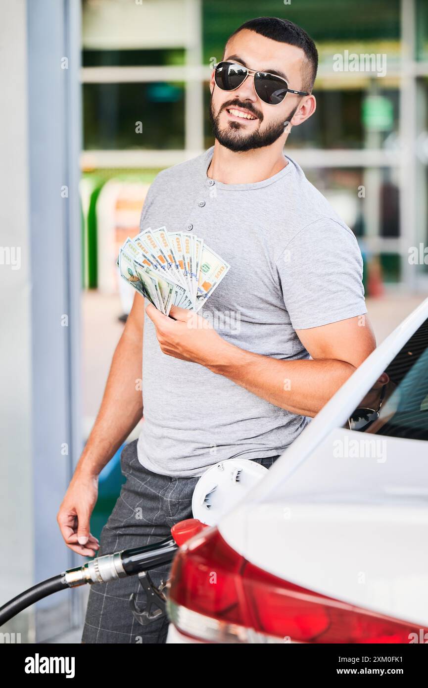 Portrait casual man counting dollars hi-res stock photography and ...