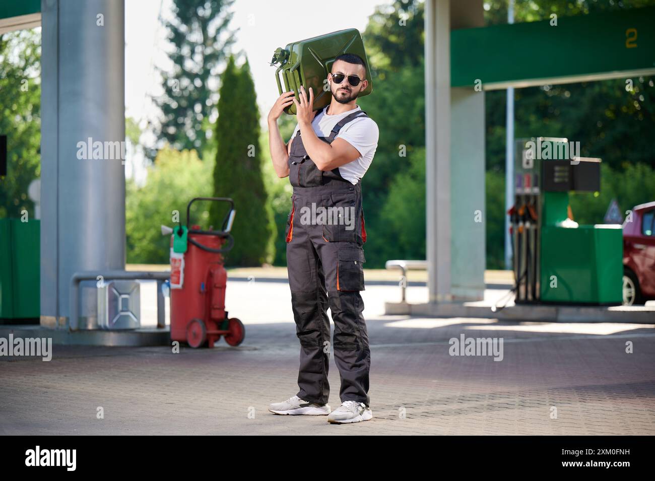 Strong gas station worker hi-res stock photography and images - Alamy