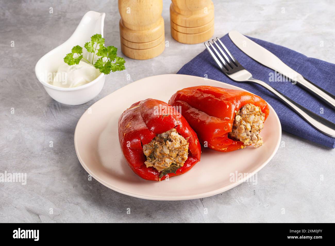 Stuffed bell pepper with minced meat and rice. Served sour cream Stock ...