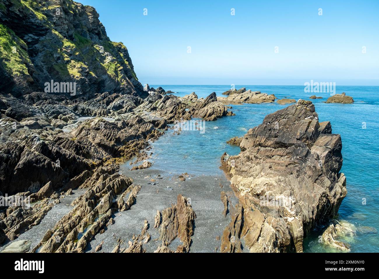 View across the rocky bay from Capstone Hill in the Devonshire town of ...