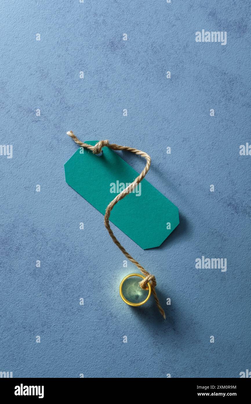Label attached to a gold ring Stock Photo - Alamy