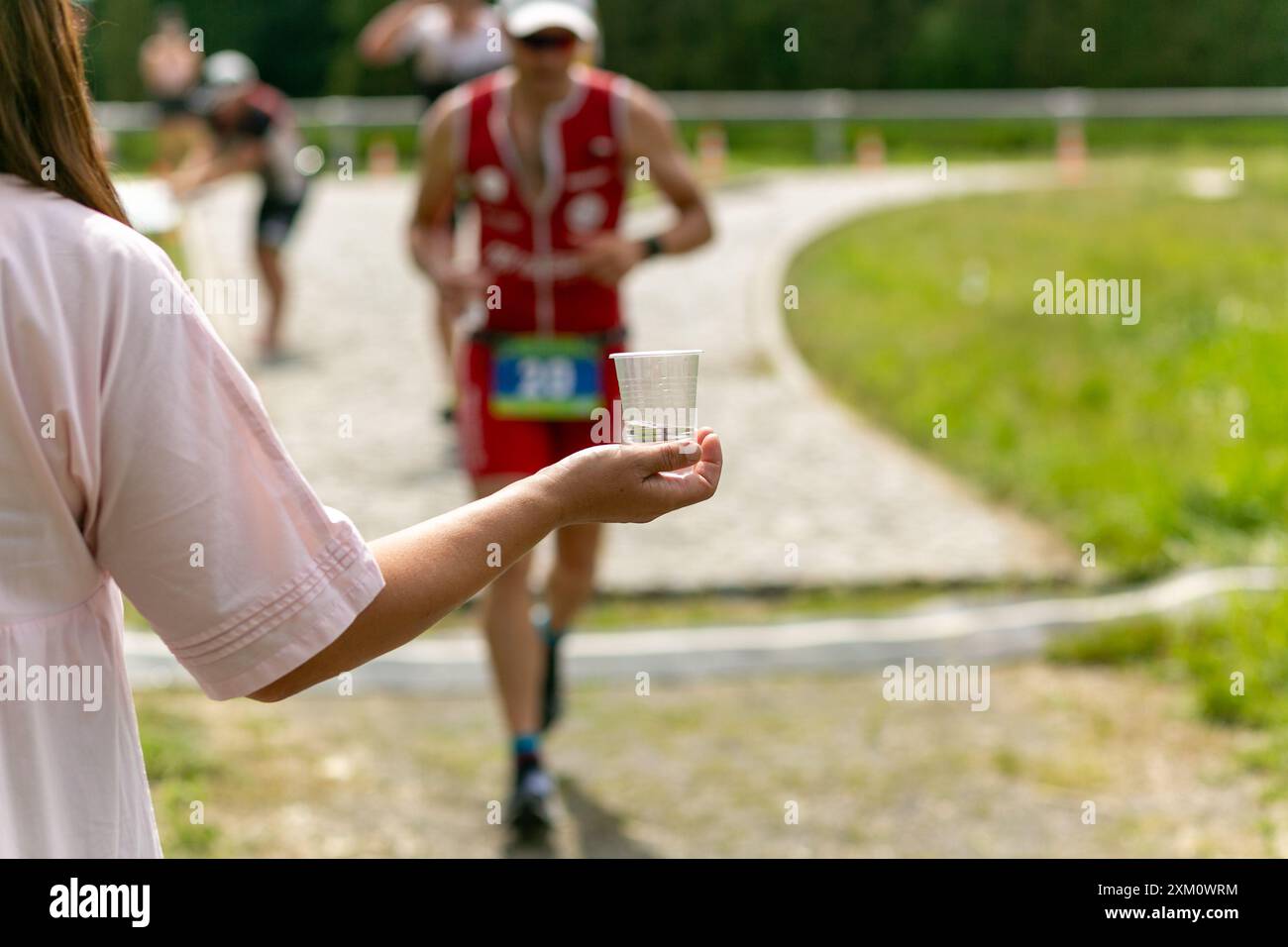 Giving out water to runners hi-res stock photography and images - Alamy