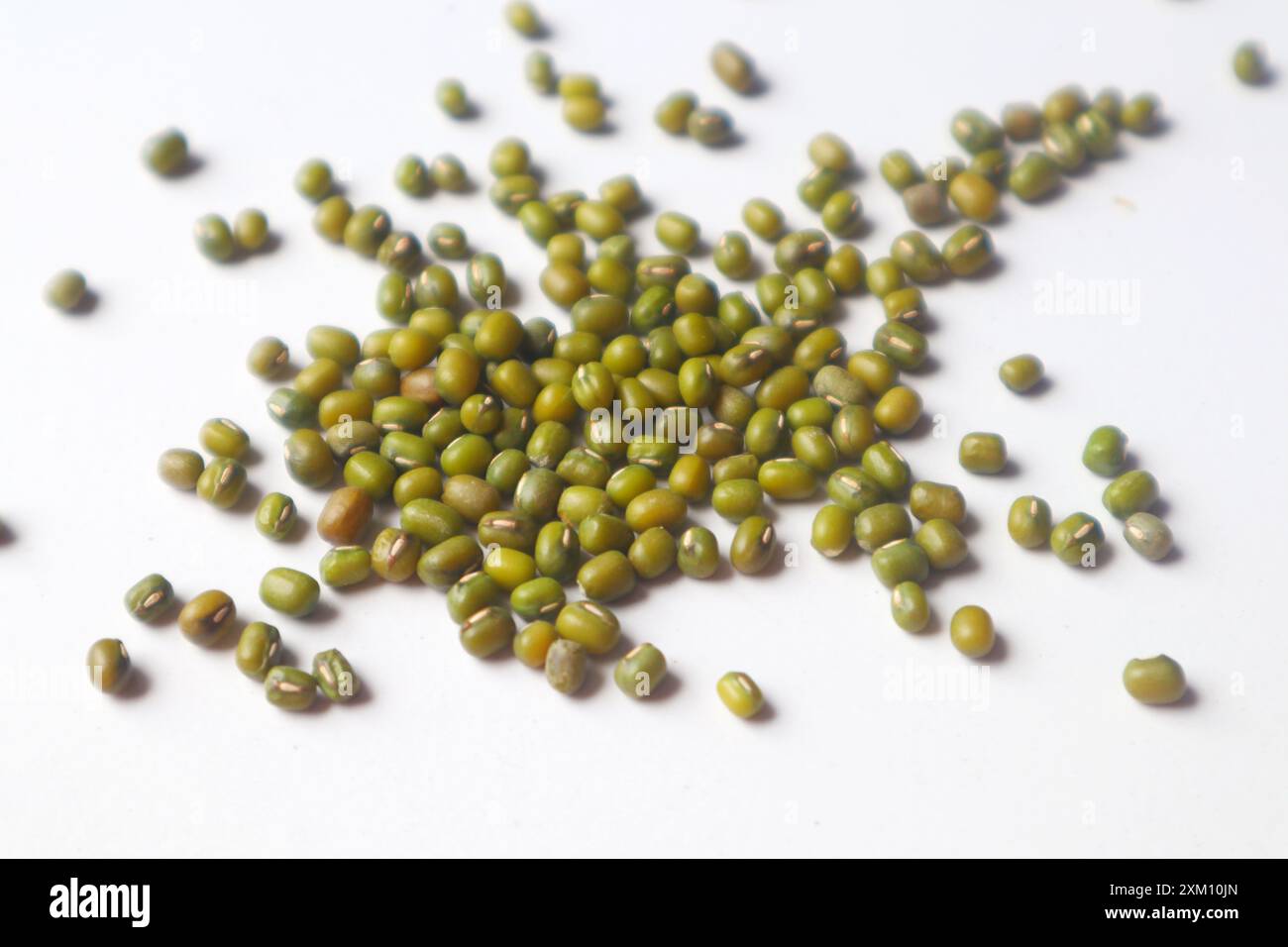 Green beans (Vigna radiata) scattered in close view on white background ...