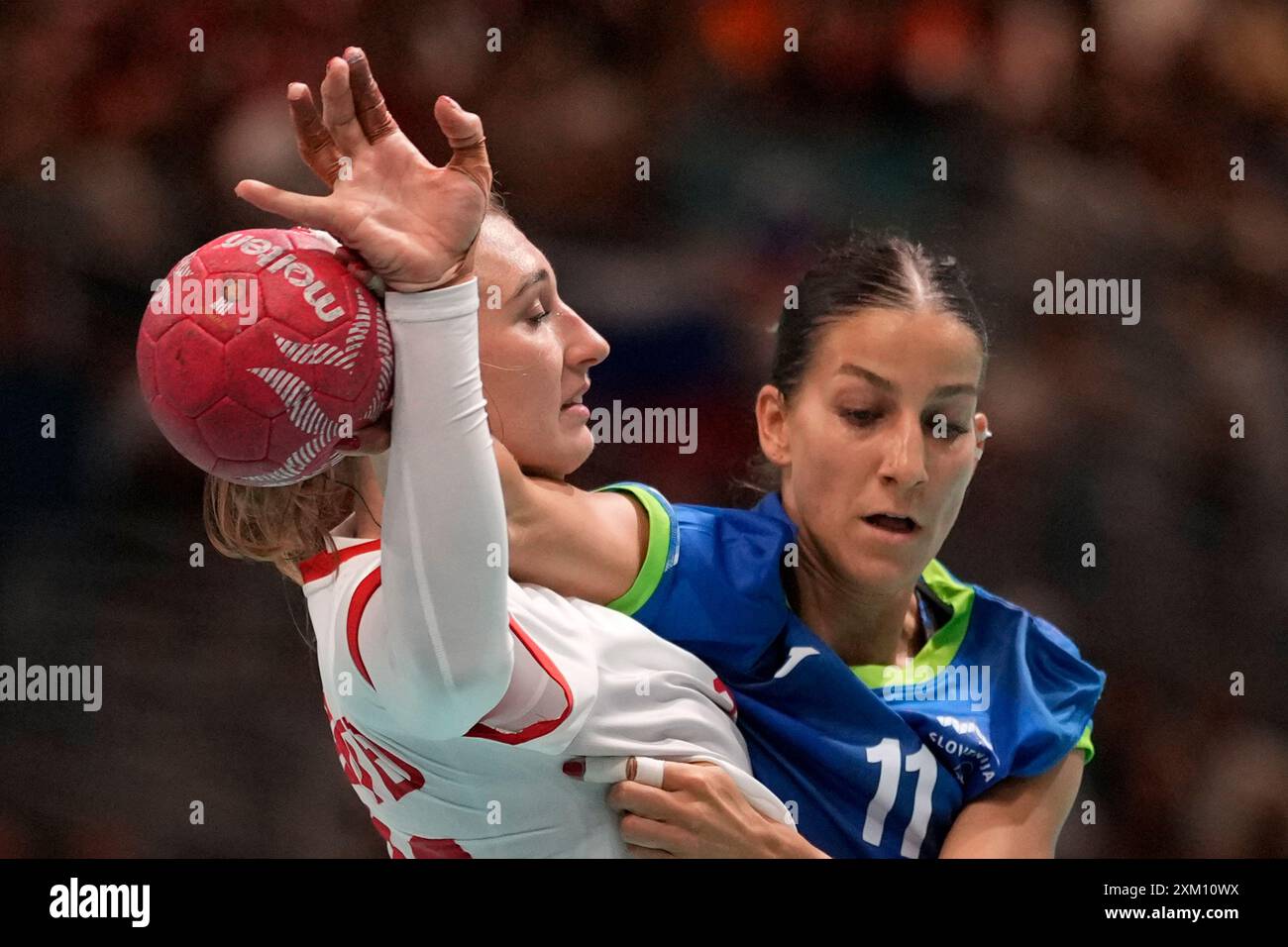 Line Haugsted, left, of Denmark, tries to stop the ball against Ana ...