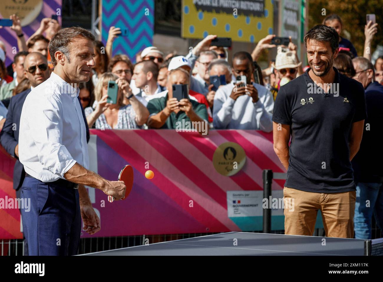 FILE - French President Emmanuel Macron plays table tennis while Paris ...