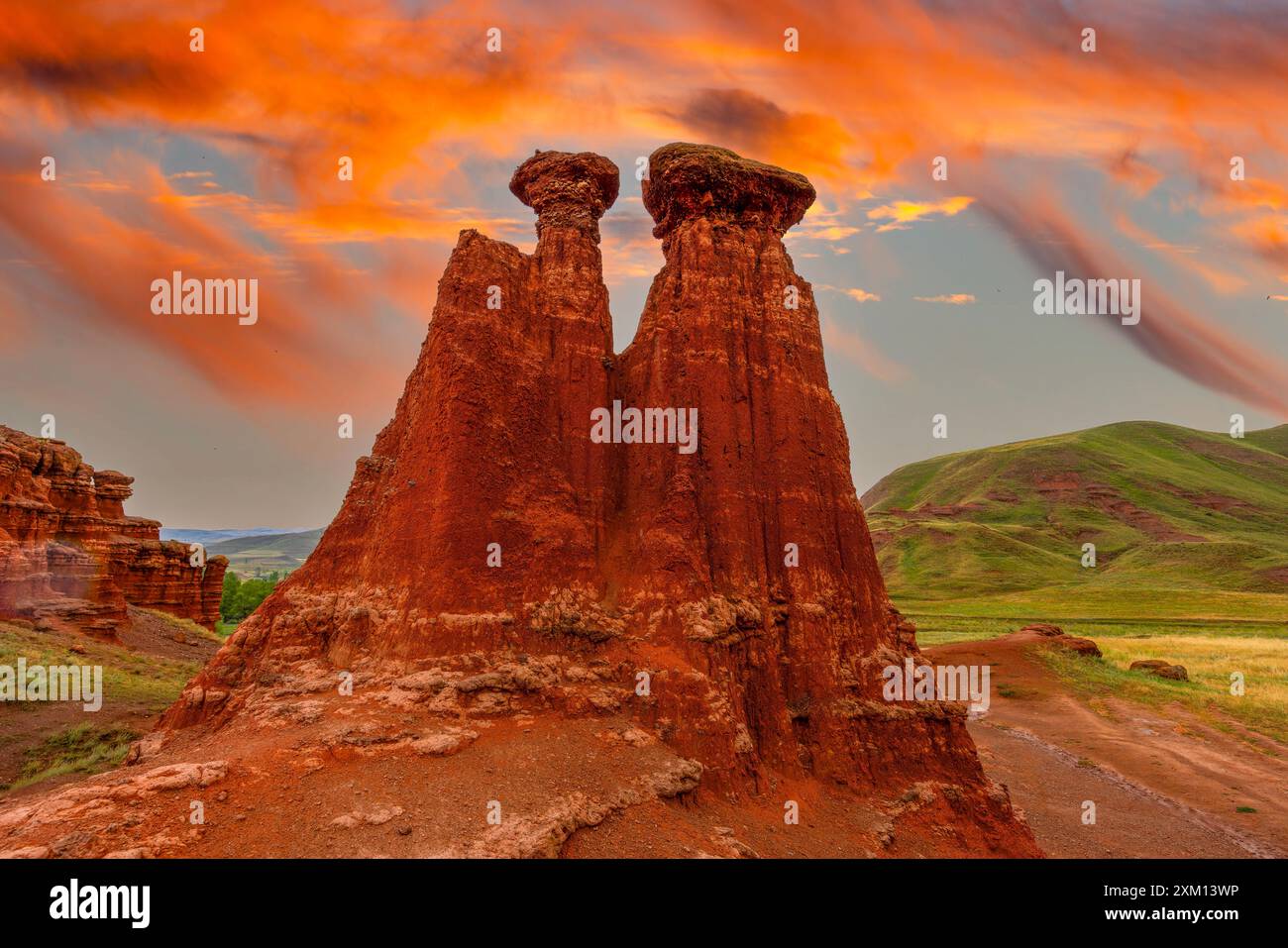 Red fairy chimneys shaped like formations that are millions of years ...