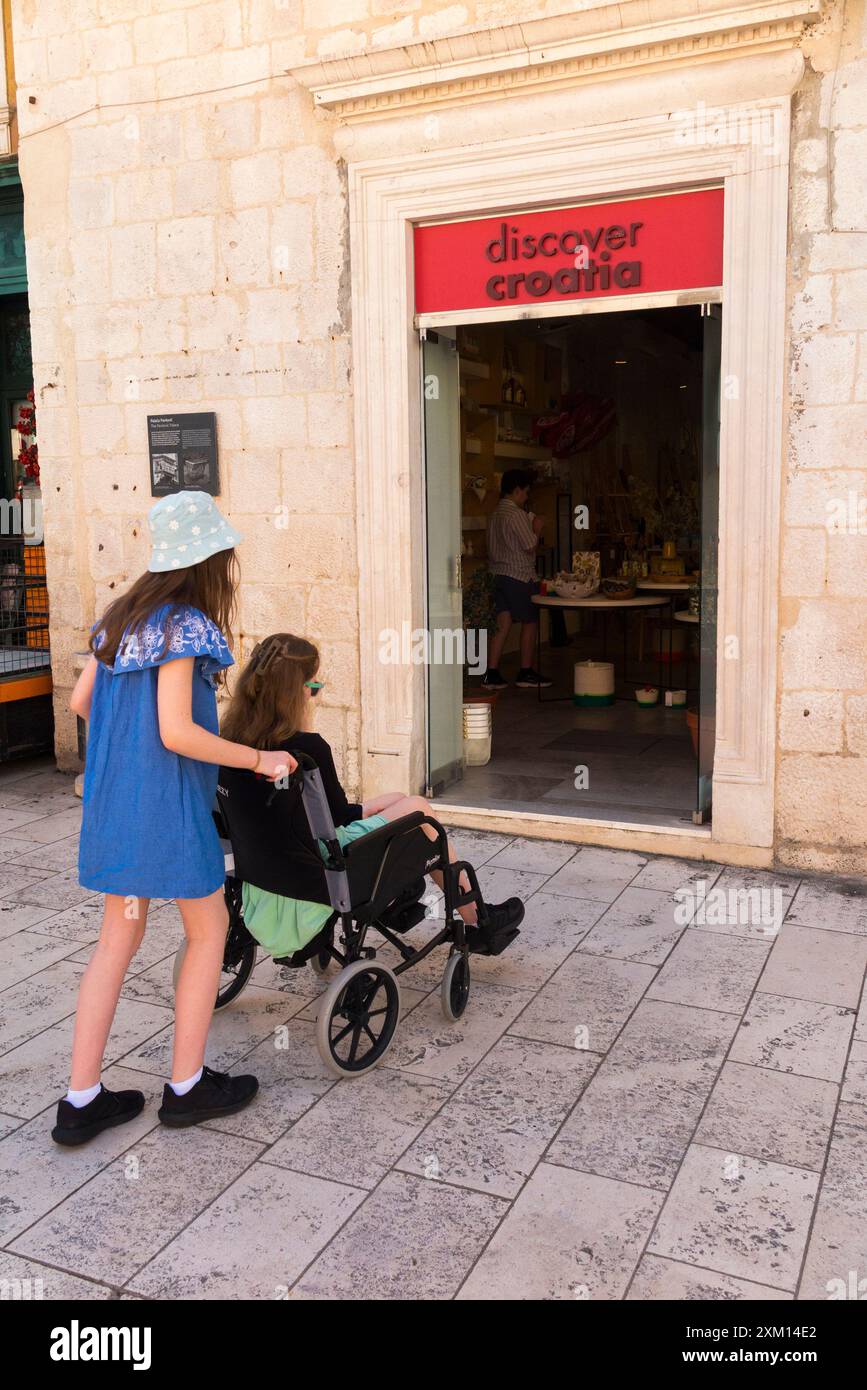 Carer & girl / child / kid / teen in wheelchair. Disabled access ...