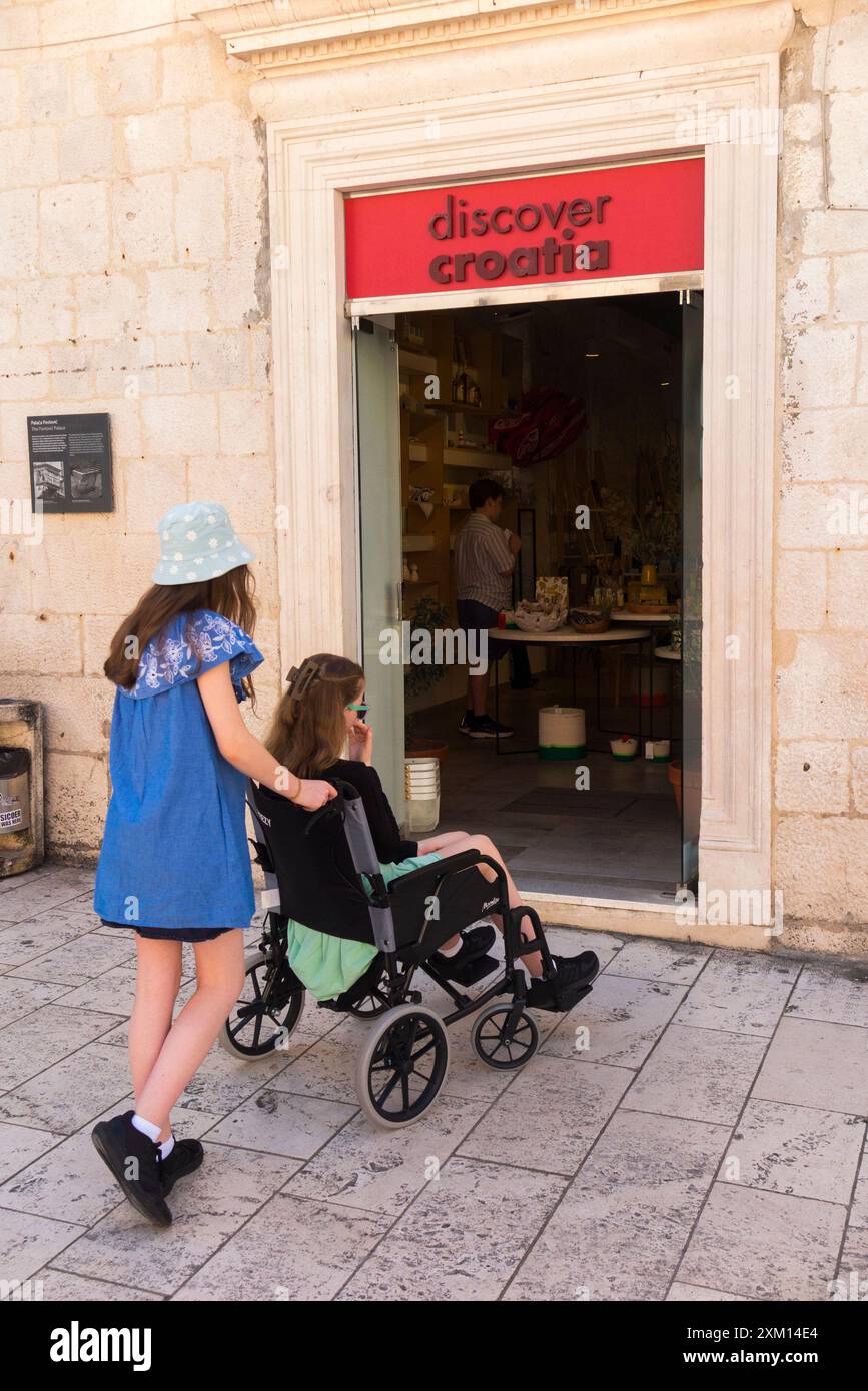 Carer & girl / child / kid / teen in wheelchair. Disabled access ...