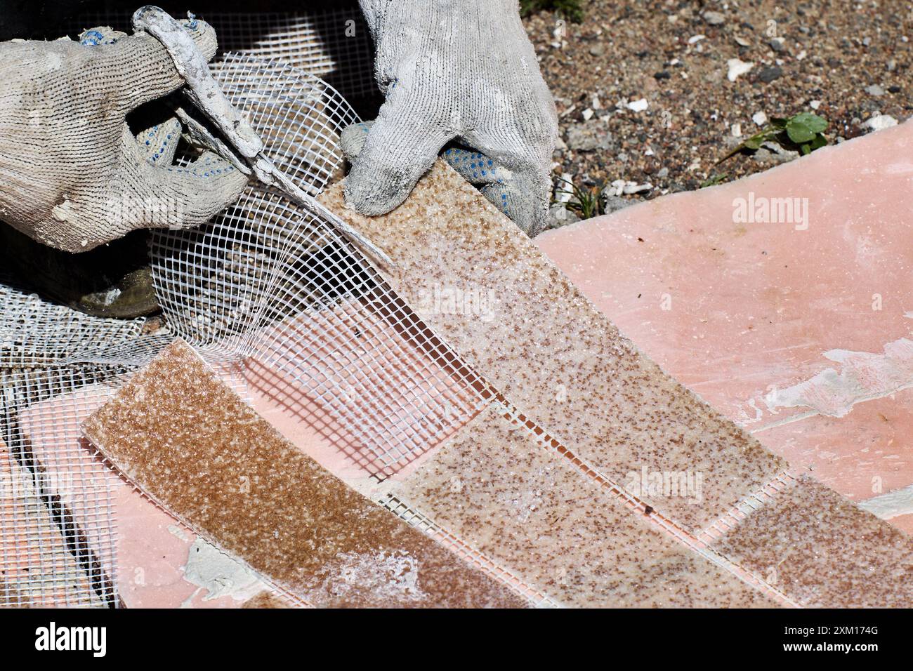 Thin fake bricks made of acrylic marble chips are reinforced with ...