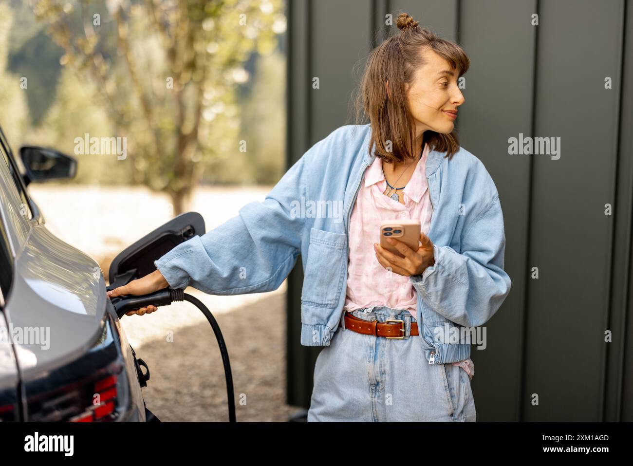 Woman plugging smartphone power hi-res stock photography and images - Alamy