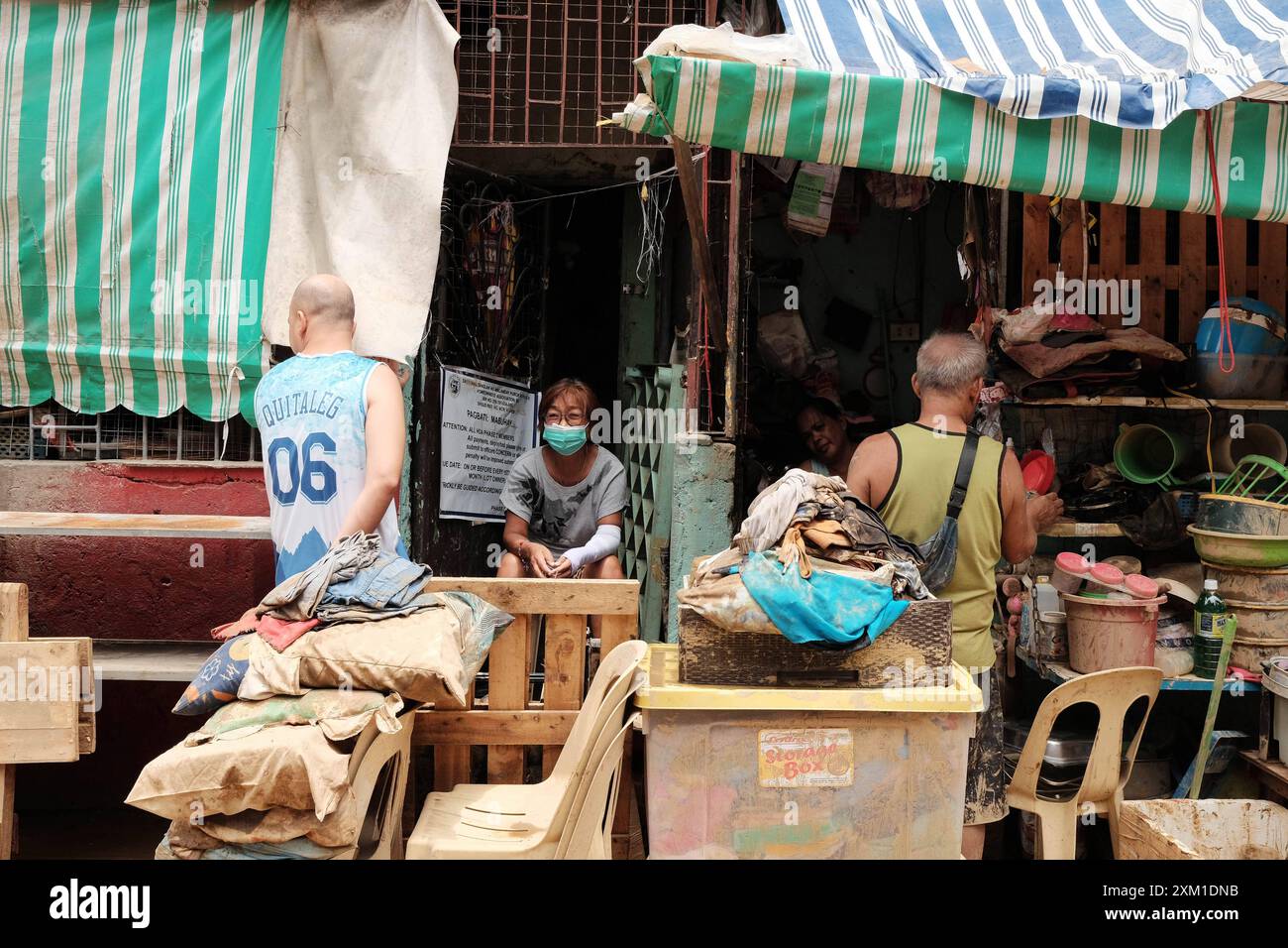 On July 25, 2024, residents of Marikina, Philippines, clean their homes ...