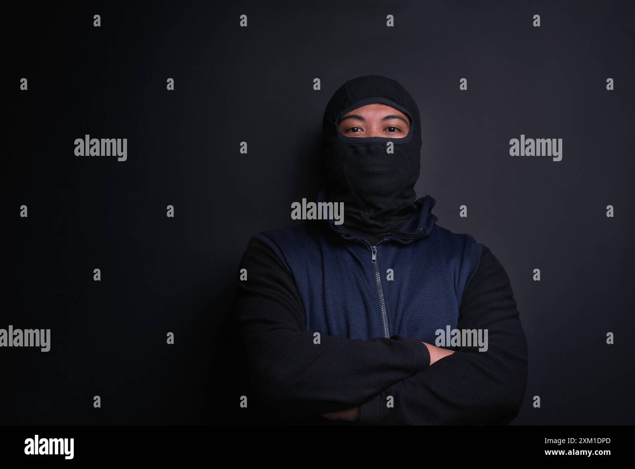Man, portrait and mask of robber in studio, burglar and criminal or ...