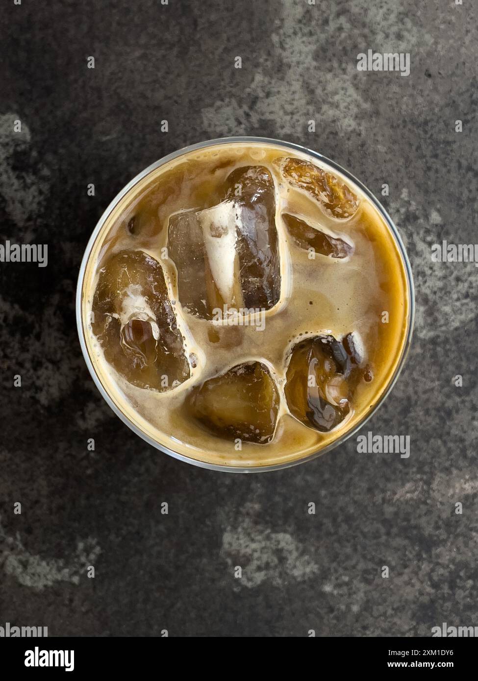 Glass of iced coffee on dark background. Top view Stock Photo - Alamy