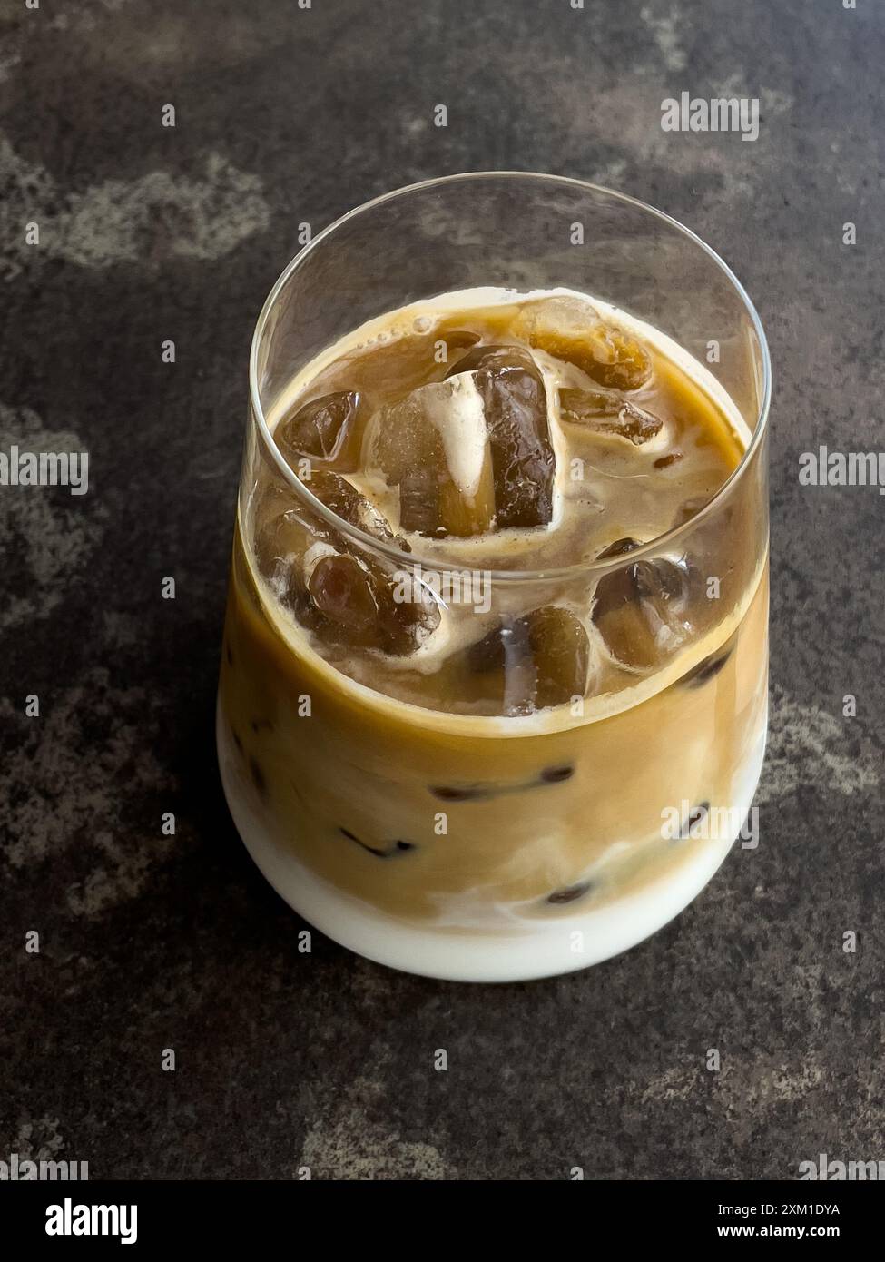 Glass of iced coffee on dark background. Top view Stock Photo - Alamy