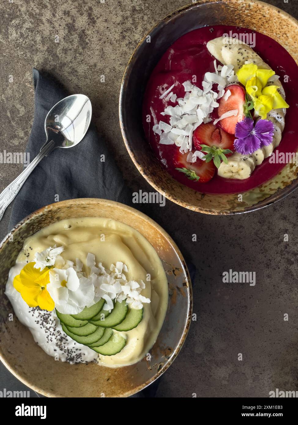 Colourful smoothie bowls beautifully decorated with fruits, nuts and ...
