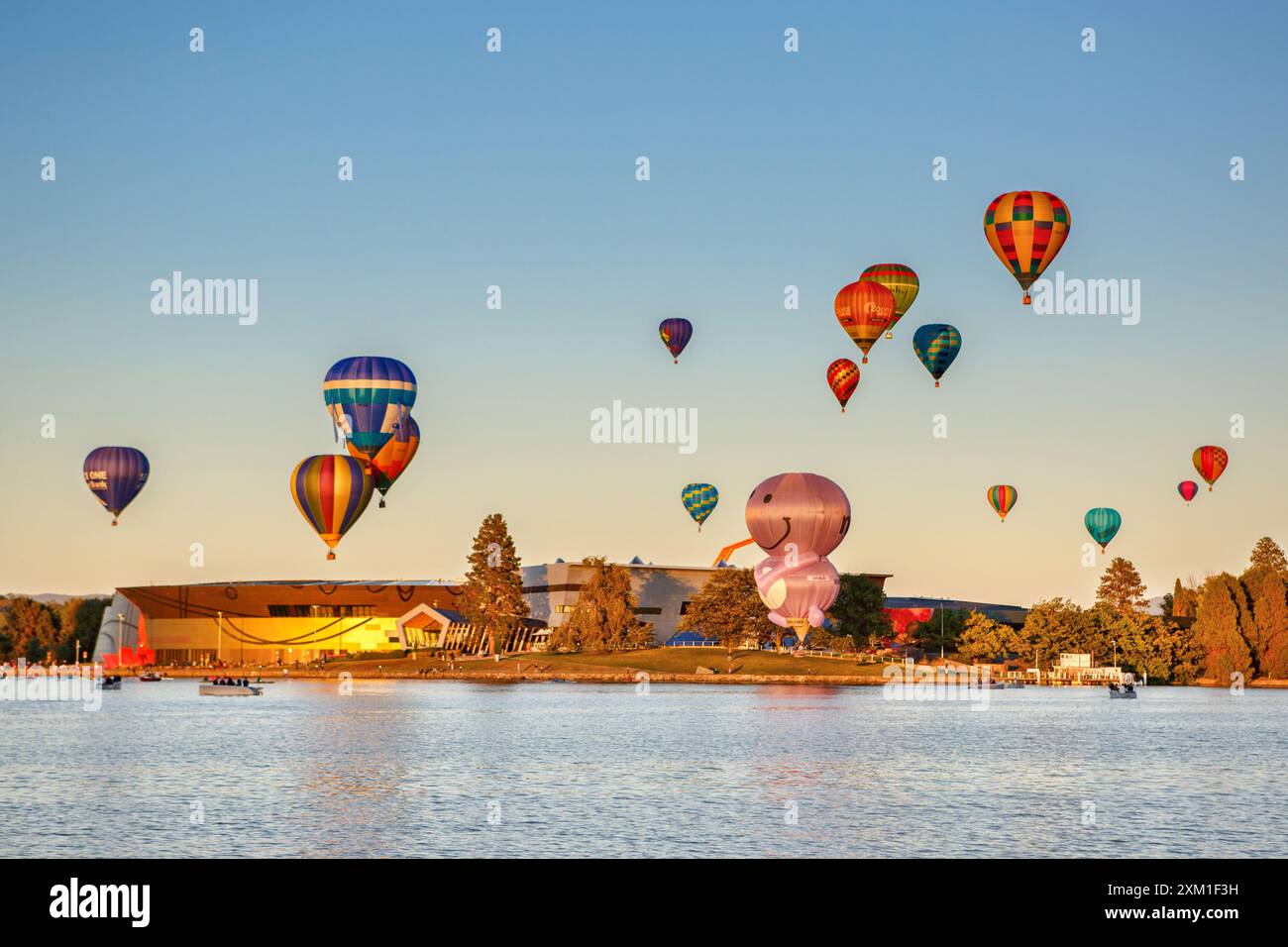 Hot air balloons float over the National Museum of Australia during the ...