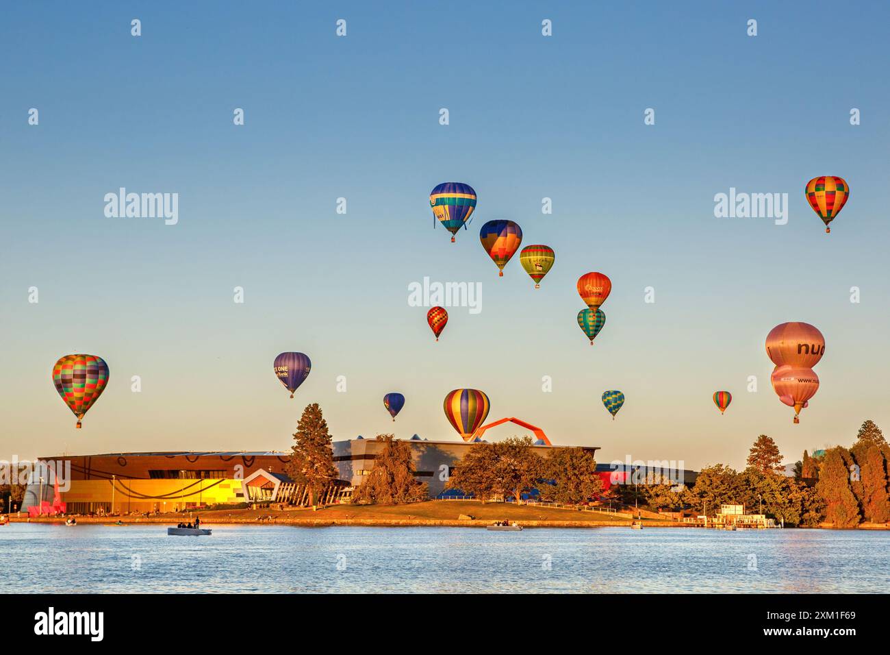 Hot air balloons float over the National Museum of Australia during the ...