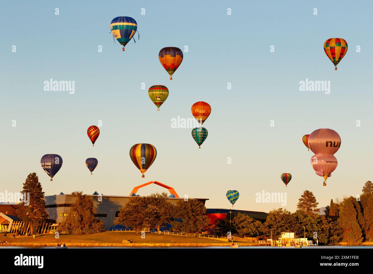 Hot air balloons float over the National Museum of Australia during the ...