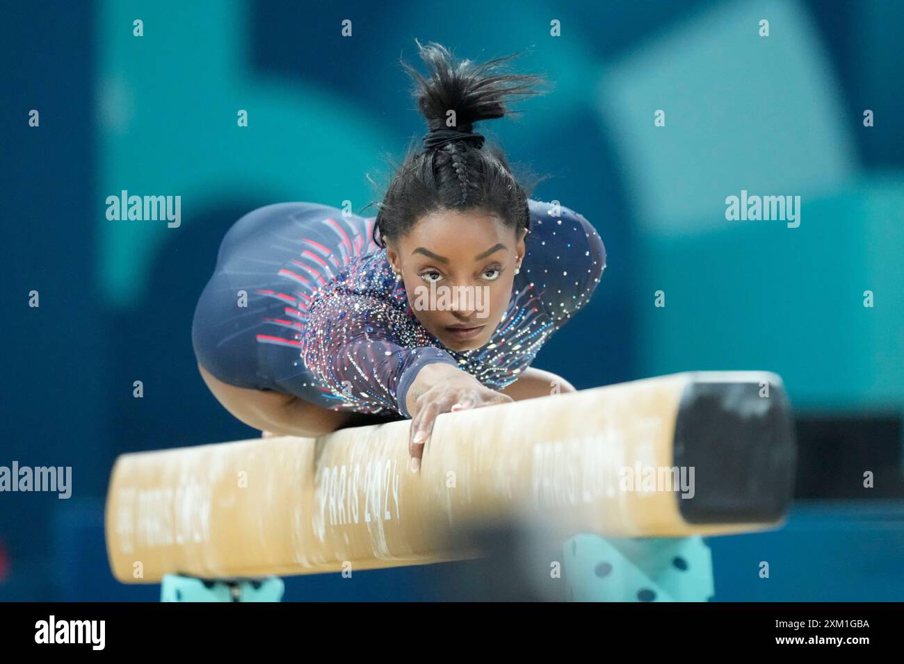 Simone Biles of the United States practices the balance beam during a ...