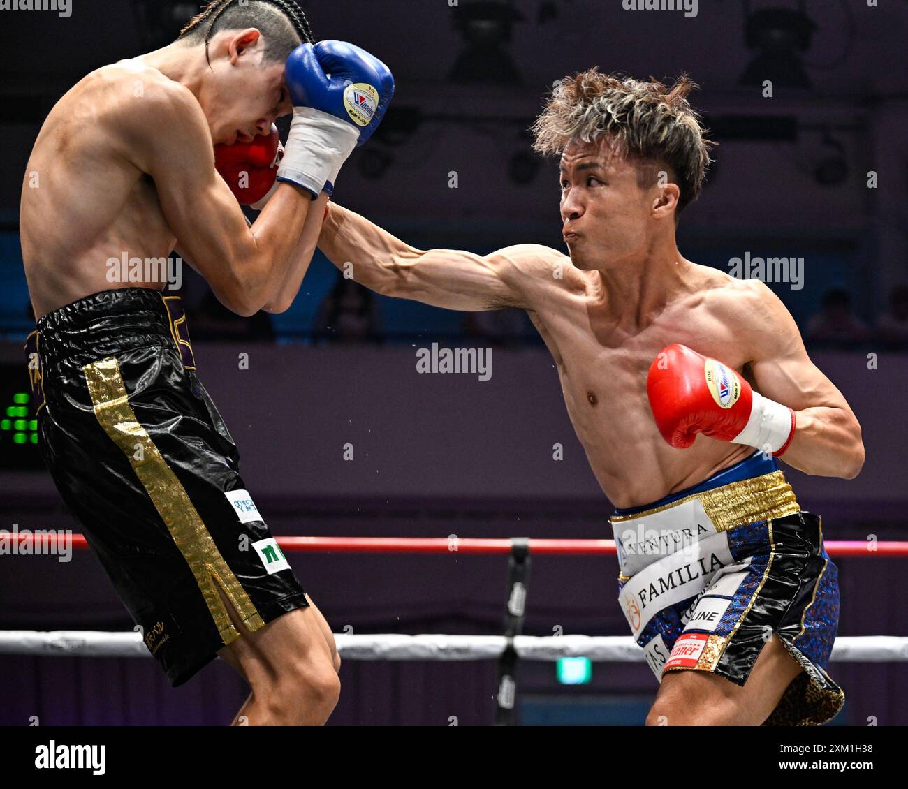 Tokyo, Japan. 18th July, 2024. Seiya Yamaguchi (red gloves) hits Shunsuke Honda (blue gloves) in ...