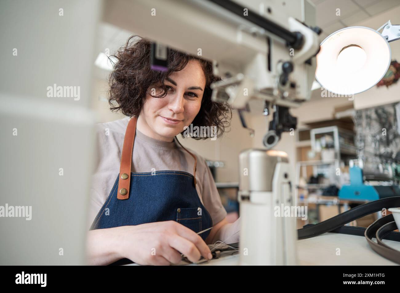 Woman tanner sews leather hi-res stock photography and images - Alamy