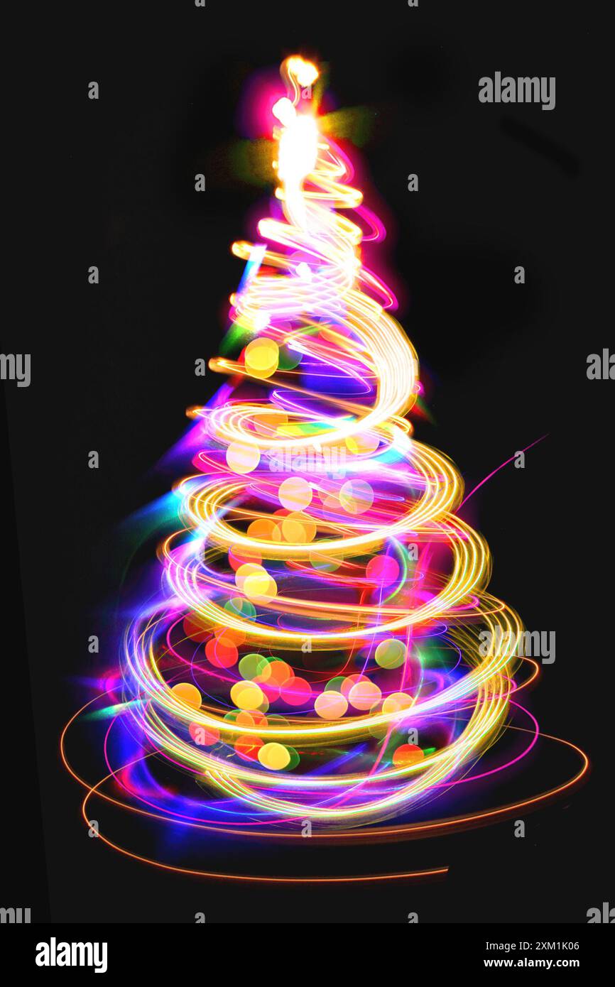 christmas tree with the color lights in the night Stock Photo - Alamy