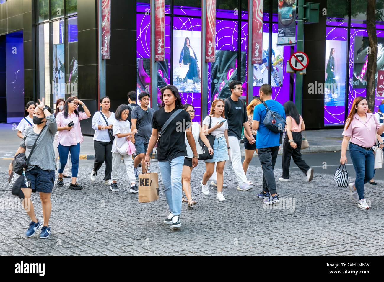 Pedestrians walking in Bonifacio Global City, BGC, Manila, Philippines ...