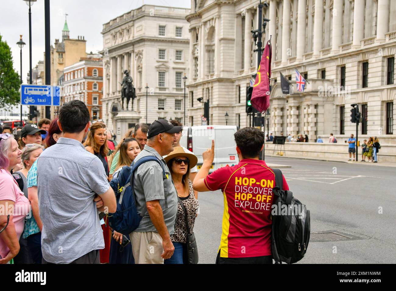London, England, UK - 27 June 2023: Tour guide informing a group of ...