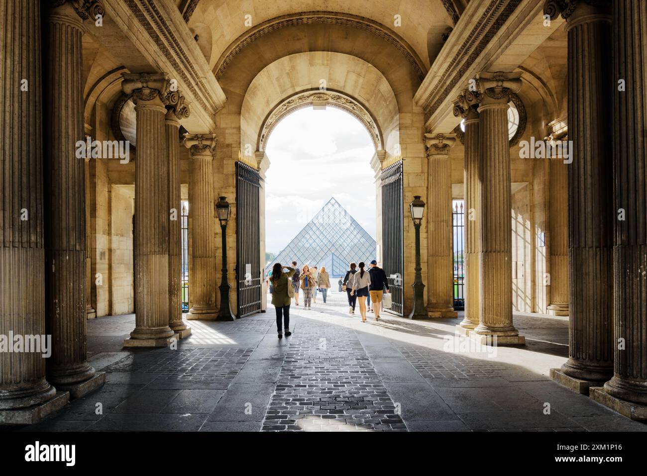 The view of the Pyramid of the Louvre through the Gate Sully in Stock ...