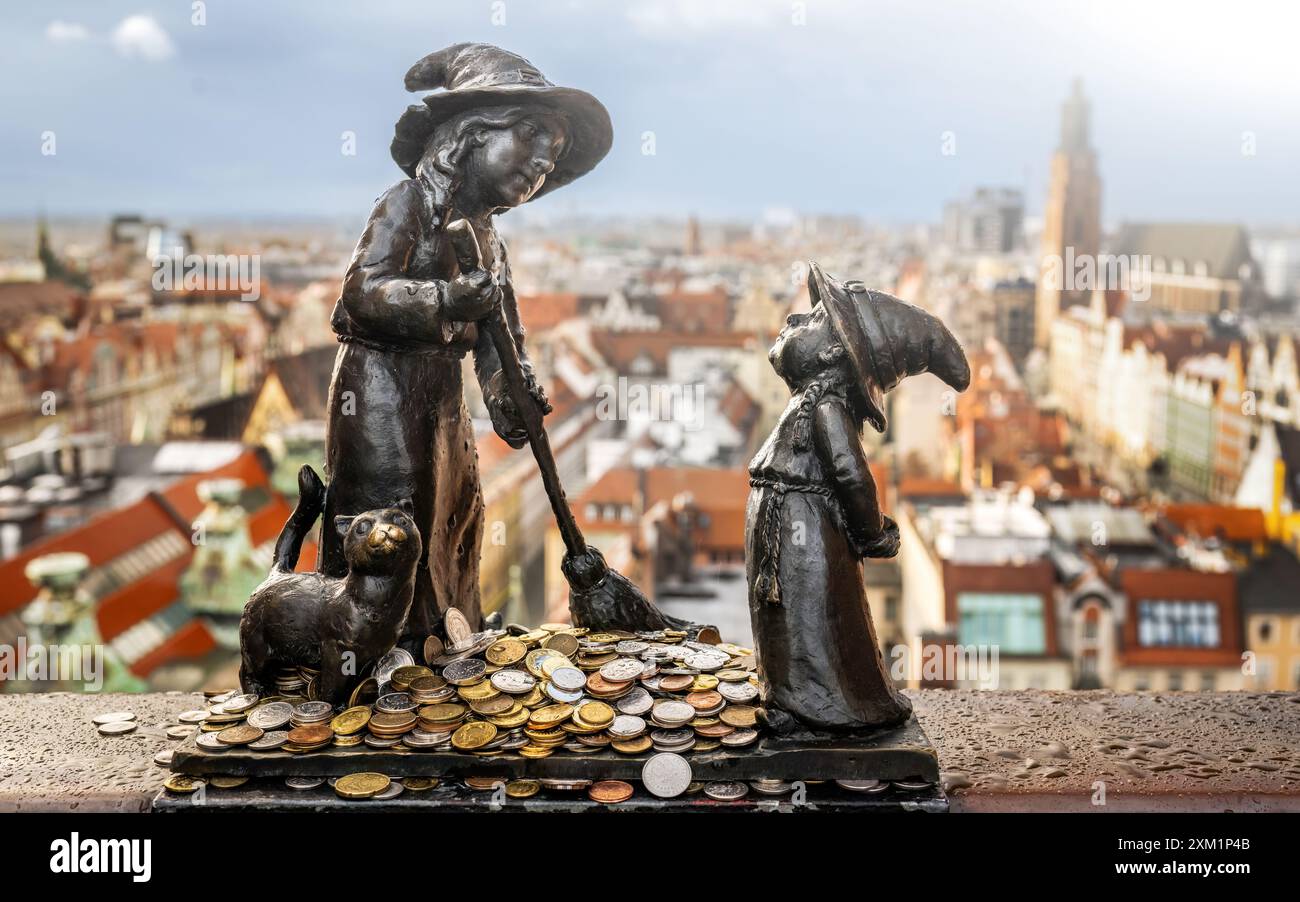 Famous dwarf gnome sculpture in Wroclaw with coins against amazing ...