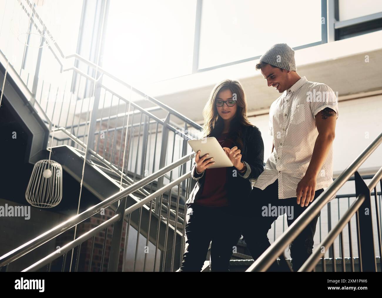 Employees, tablet and stairs for talking for design plan, graphic ...