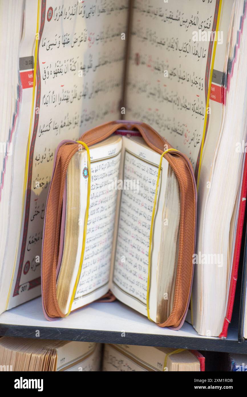 Islamic Holy Book Quran on the market shelf Stock Photo - Alamy