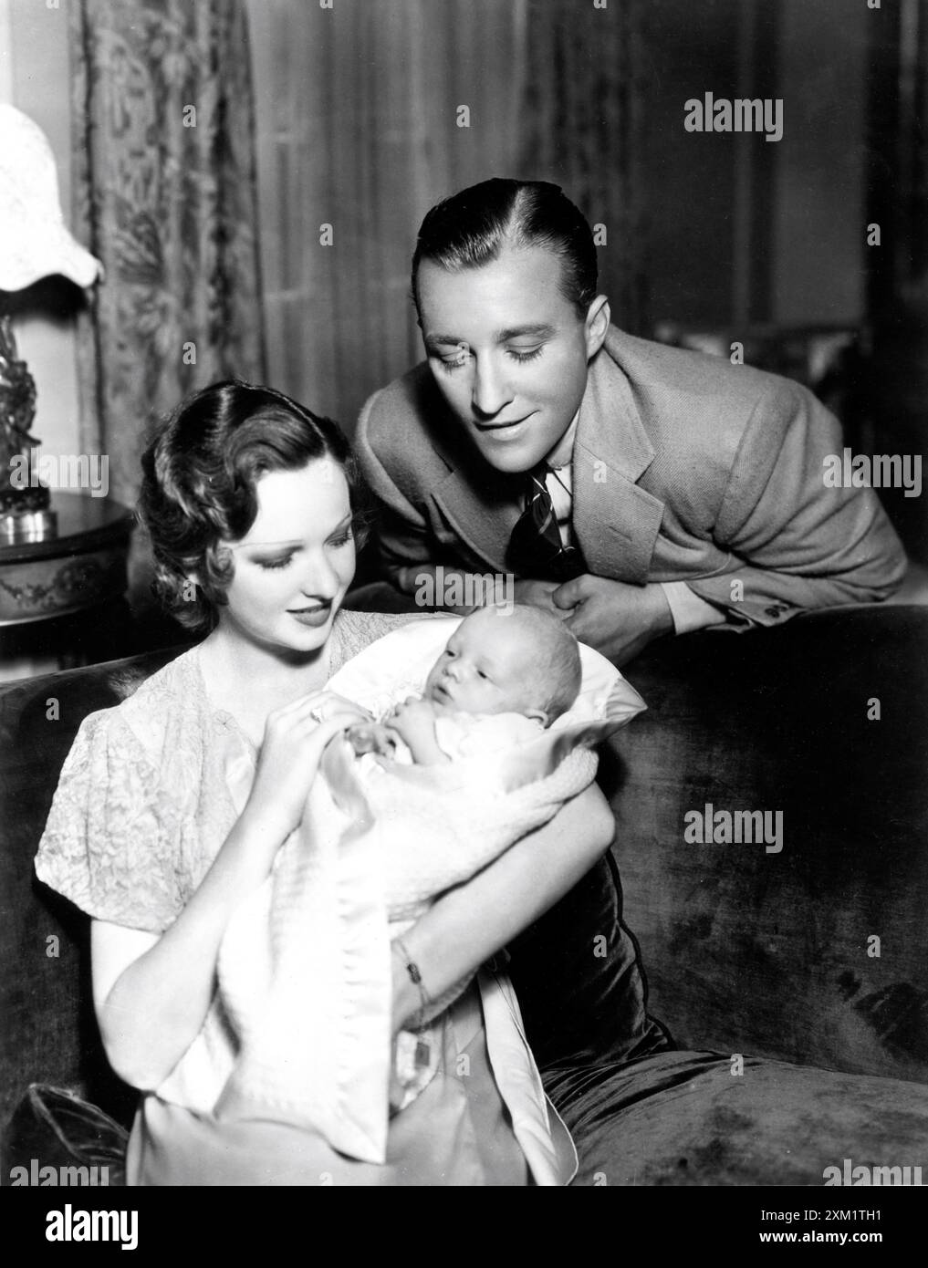 BING CROSBY and his first wife DIXIE LEE at home with their three week old son GARY EVAN CROSBY ...