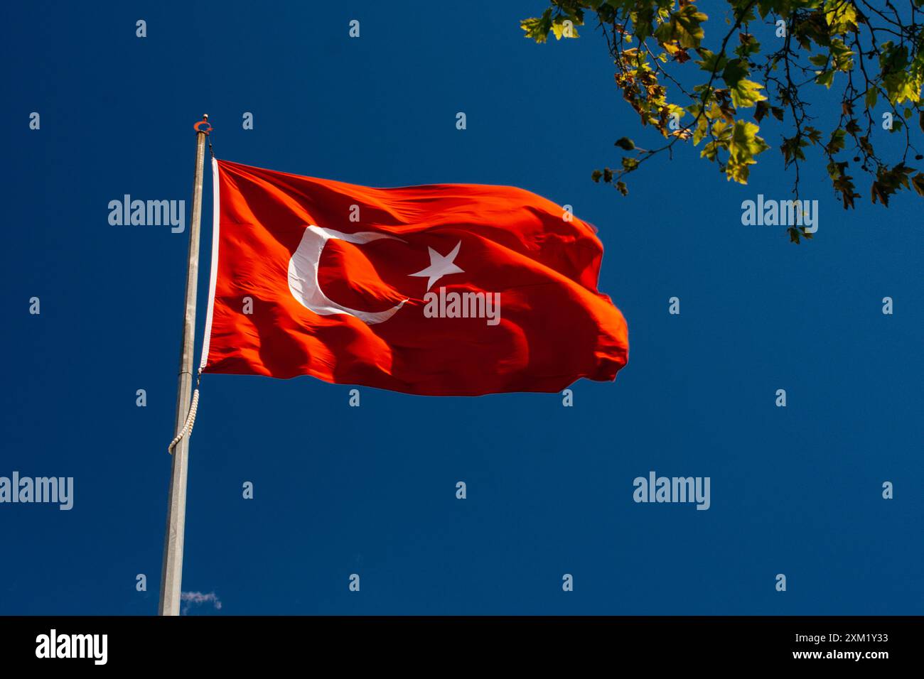 Turkish national flag with white star and moon on a pole in sky Stock ...