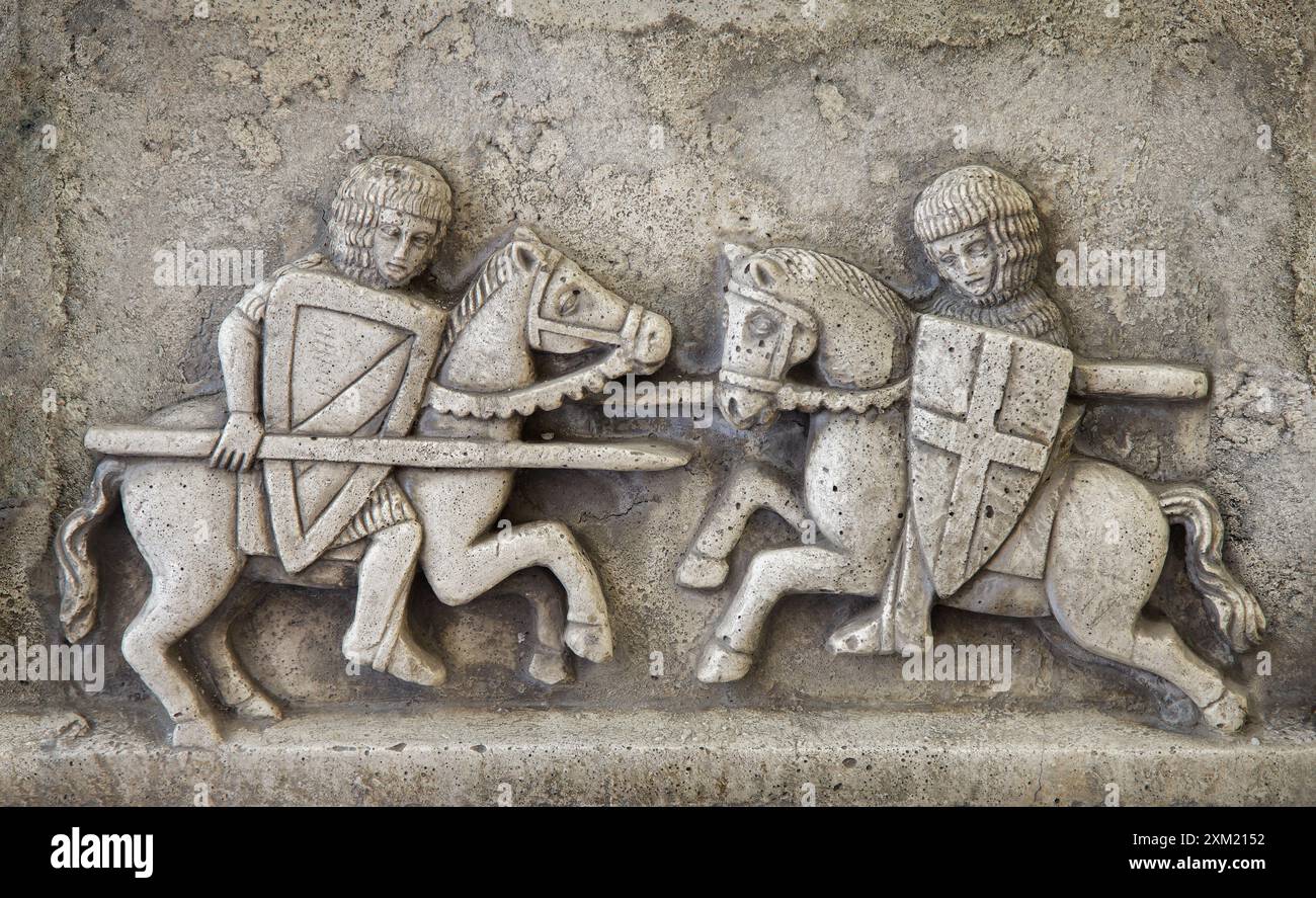 Stone frieze depicting two knight in medieval battle. Not authentic ...