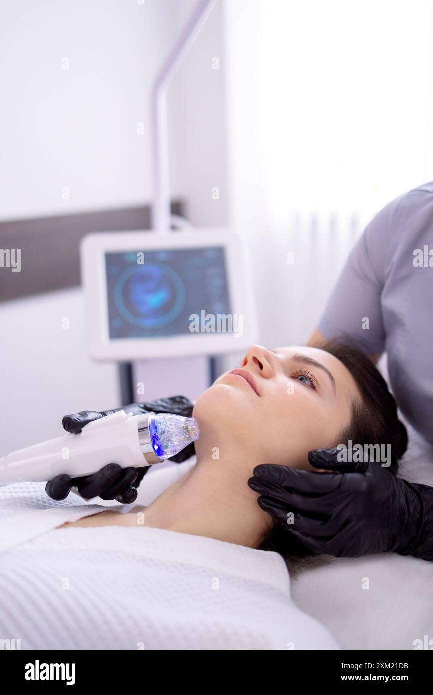 Microneedle RF lifting procedure. Hardware cosmetology. Beautician ...