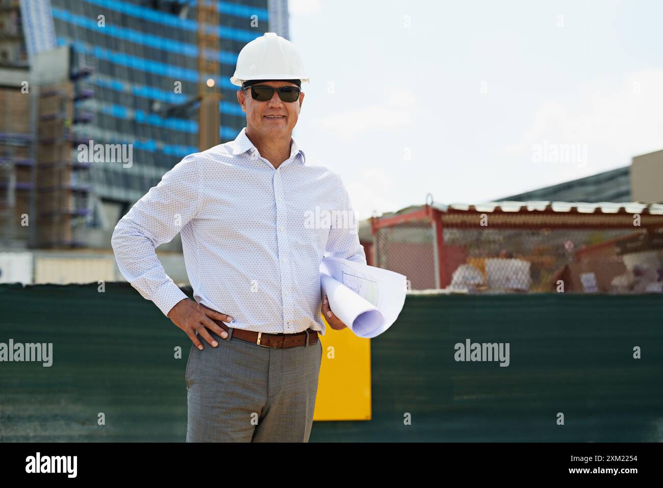 Construction site, portrait and architect man with blueprint for floor ...