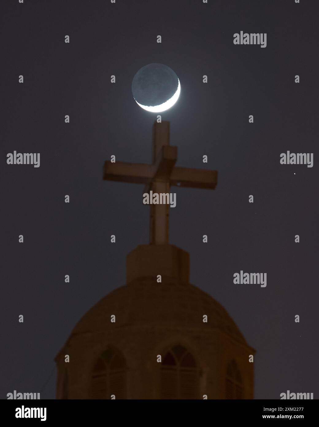 Crescent Moon Setting Behind the Cross of an Old Church in Baghdad ...