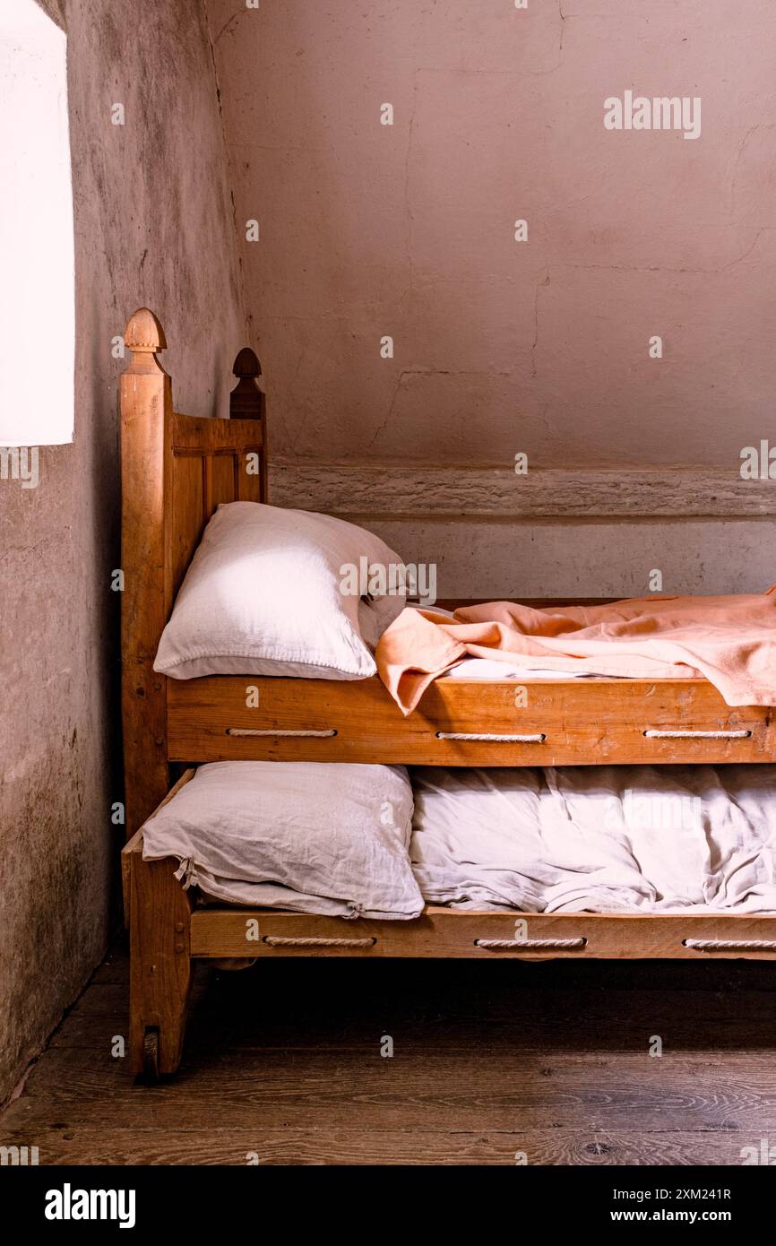 Historic bed and trundle bed in a planked floor bedroom Stock Photo - Alamy