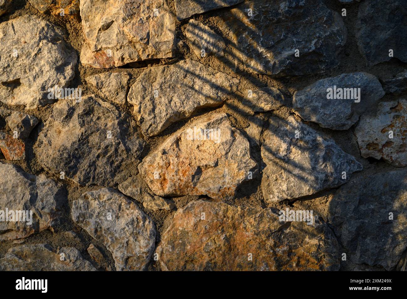 grey stone dark wall of medieval horizontal stones facade background ...