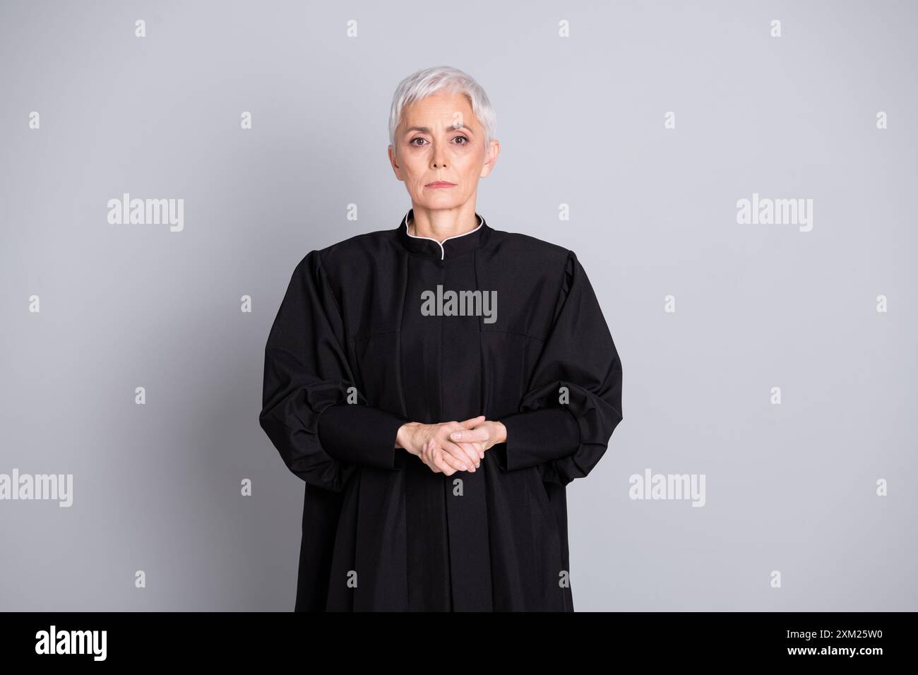 Photo of wise judge woman look serious for verdict wear black robe ...