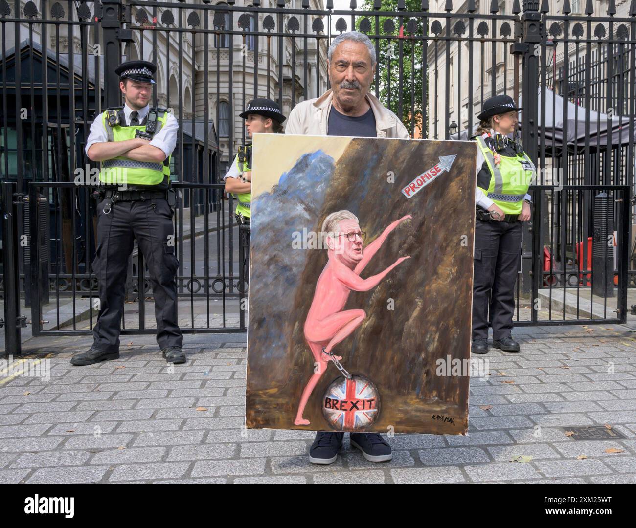 Artist Kaya Mar outside Downing Street with a picture of the new Prime ...