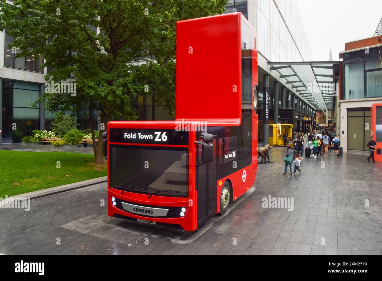 London, England, UK. 25th July, 2024. A life-size folded bus next to ...