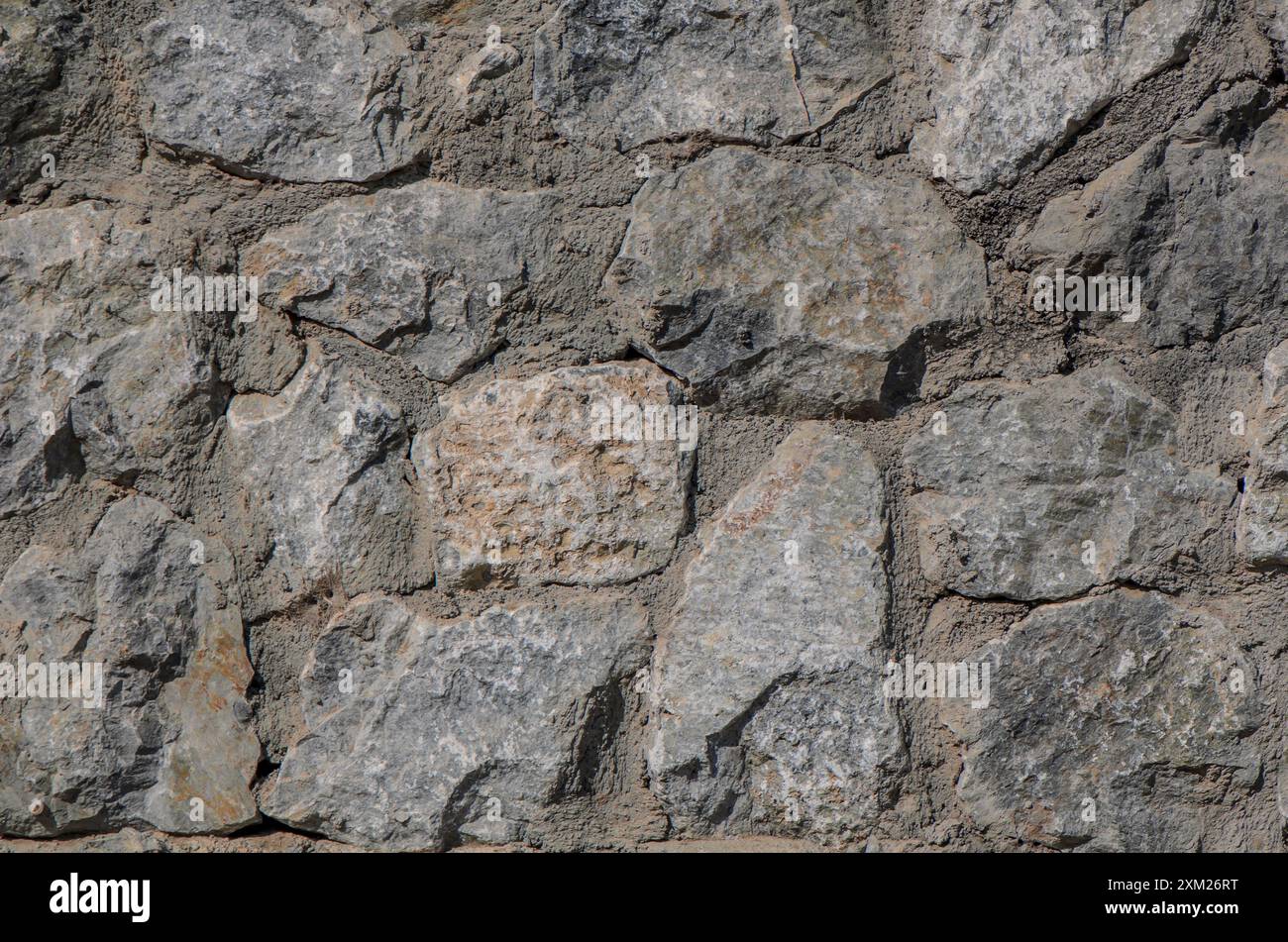 real stone wall as background Stock Photo - Alamy