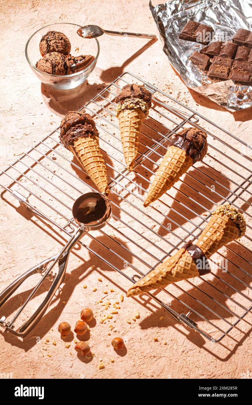 Chocolate ice cream on a metal rack with scoop from stainless steel ...