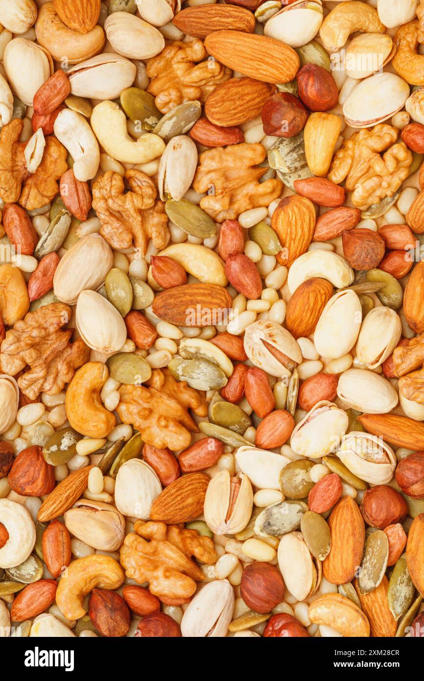 Background from different types of nuts and seeds - peeled walnut ...
